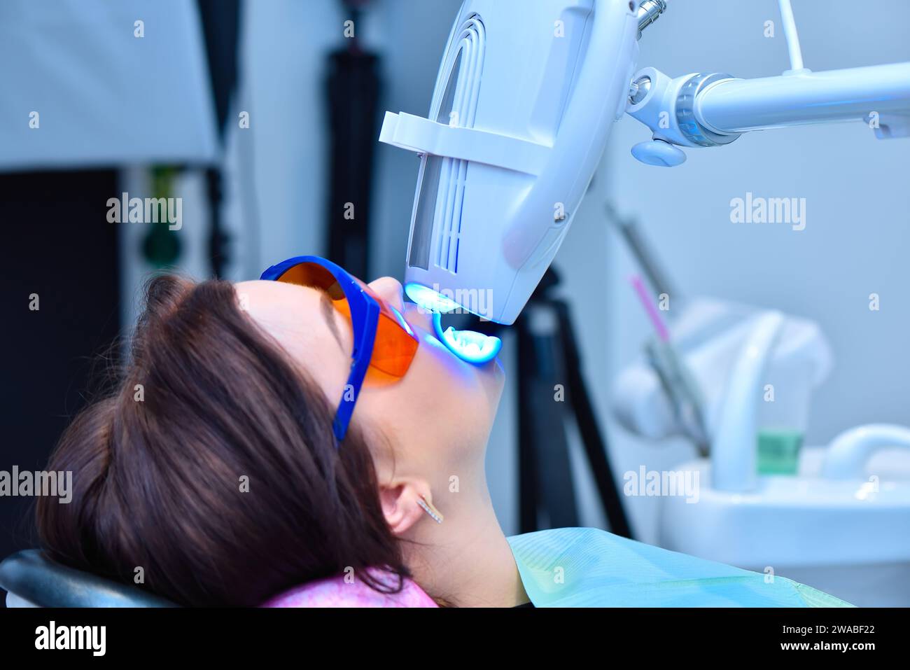 Teeth whitening for patient in dental clinic. Bleaching of teeth at ...