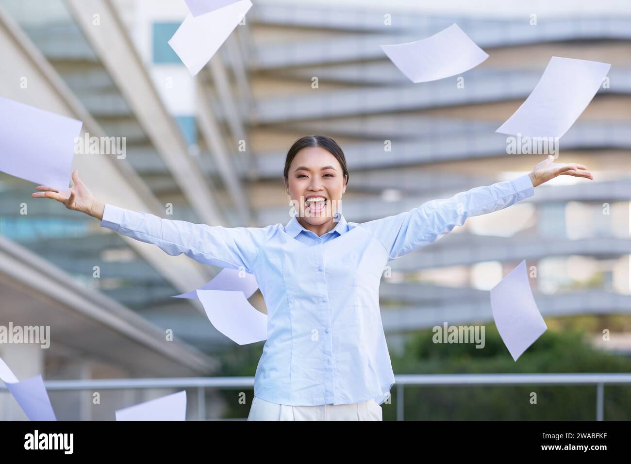 Office lady throwing papers hi-res stock photography and images - Alamy