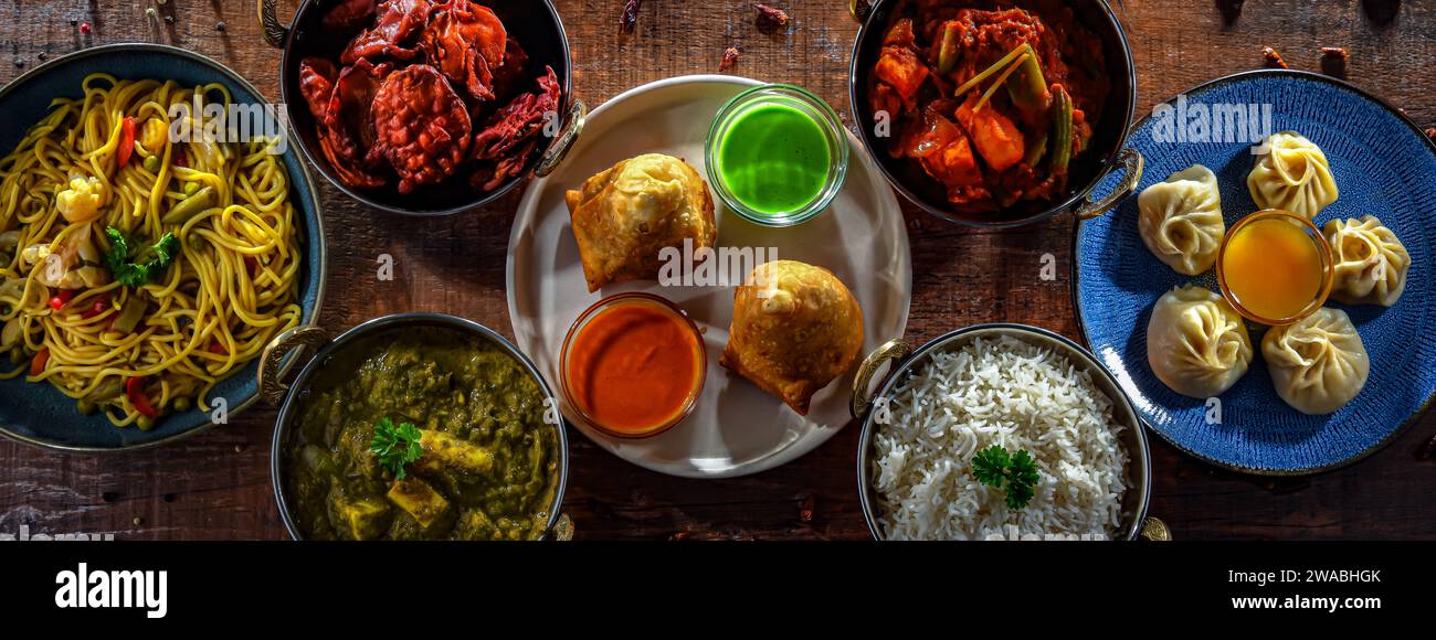 Composition with indian dishes: samosa, pakora, palak paneer, jalfrezi ...