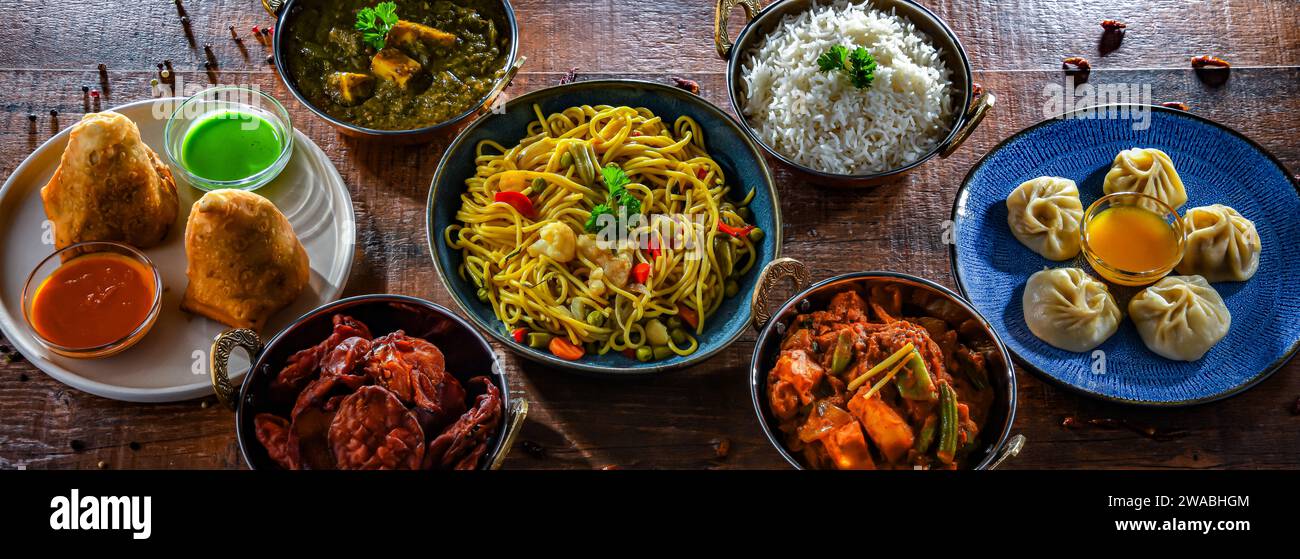 Composition with indian dishes: samosa, pakora, palak paneer, jalfrezi ...