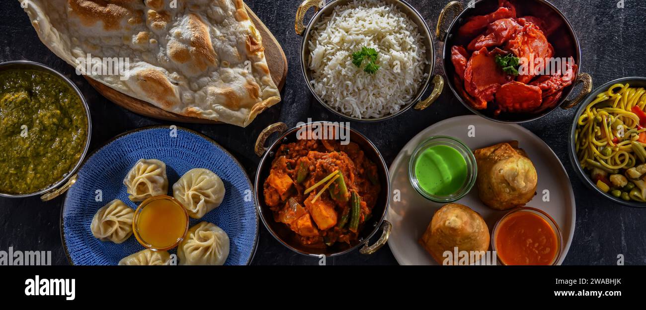 Composition with indian dishes: samosa, pakora, palak paneer, jalfrezi ...