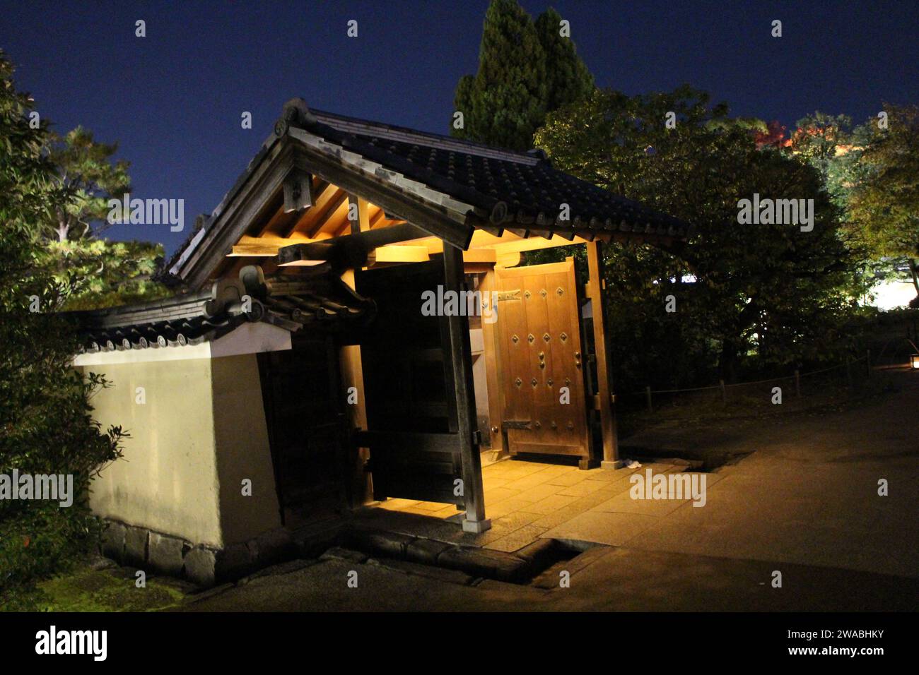 Wooden gate and illumination in the Garden with a Hill and Pond in Koko ...