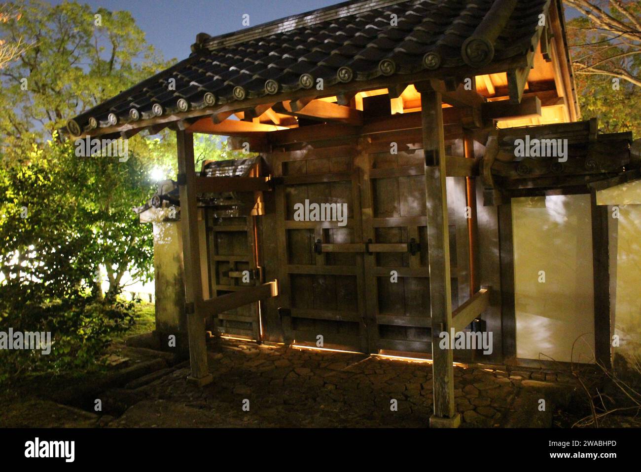 Wooden gate and illumination in the Garden of Flowers in Koko-en Garden ...