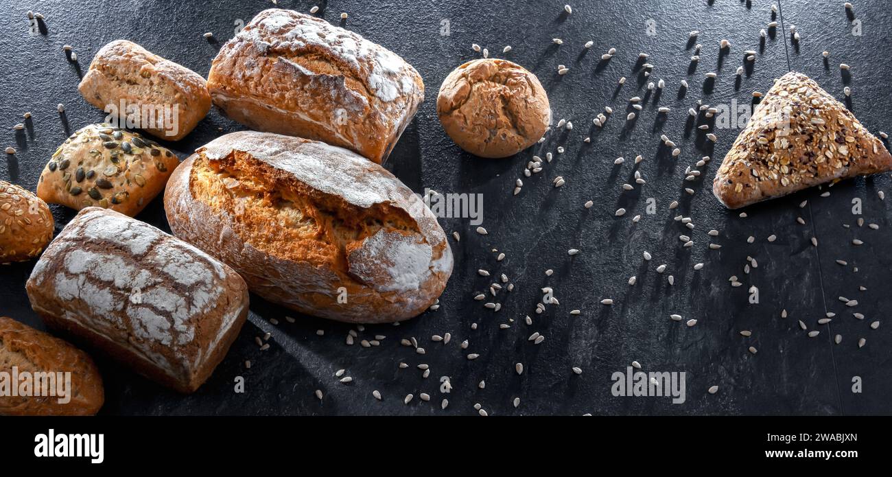 Assorted bakery products including loaves of bread and rolls Stock ...