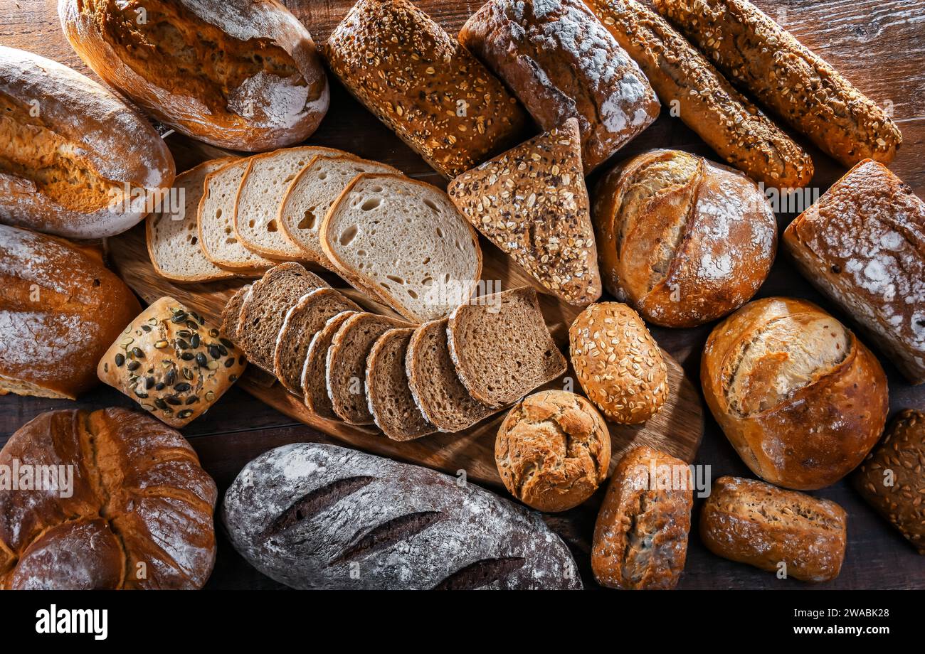 Assorted bakery products including loaves of bread and rolls Stock ...