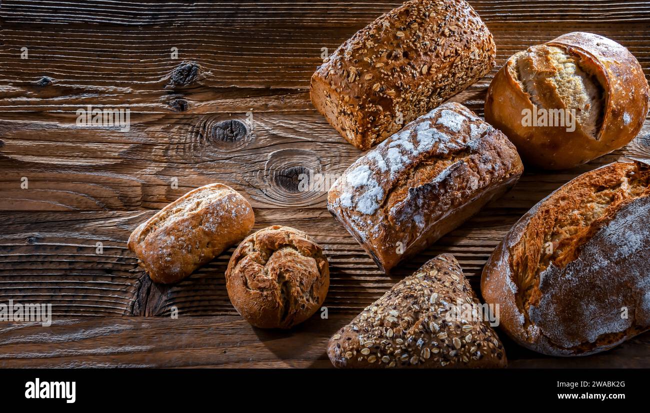 Assorted bakery products including loaves of bread and rolls Stock ...