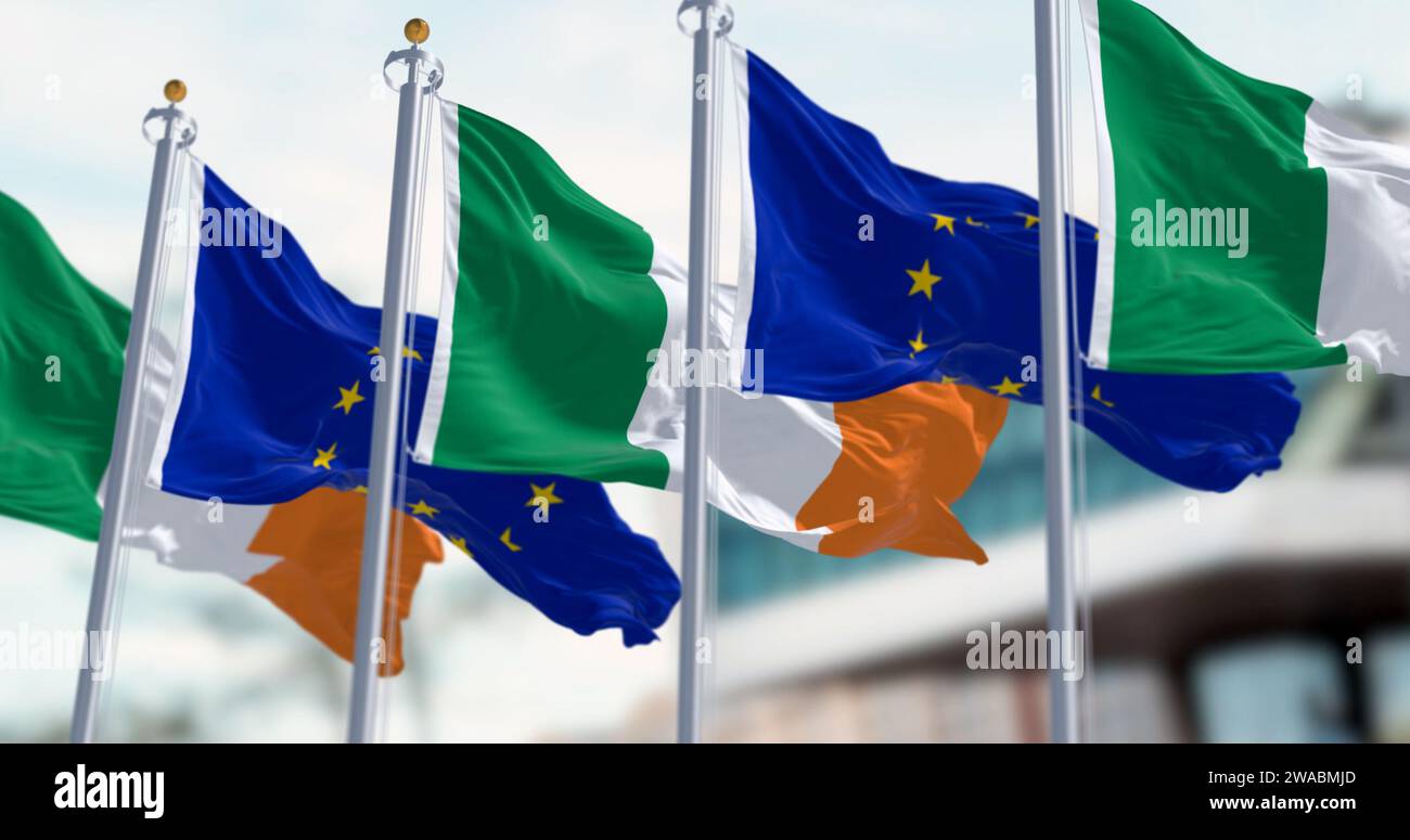 Flags of Ireland and the European Union waving on a clear day. Ireland ...