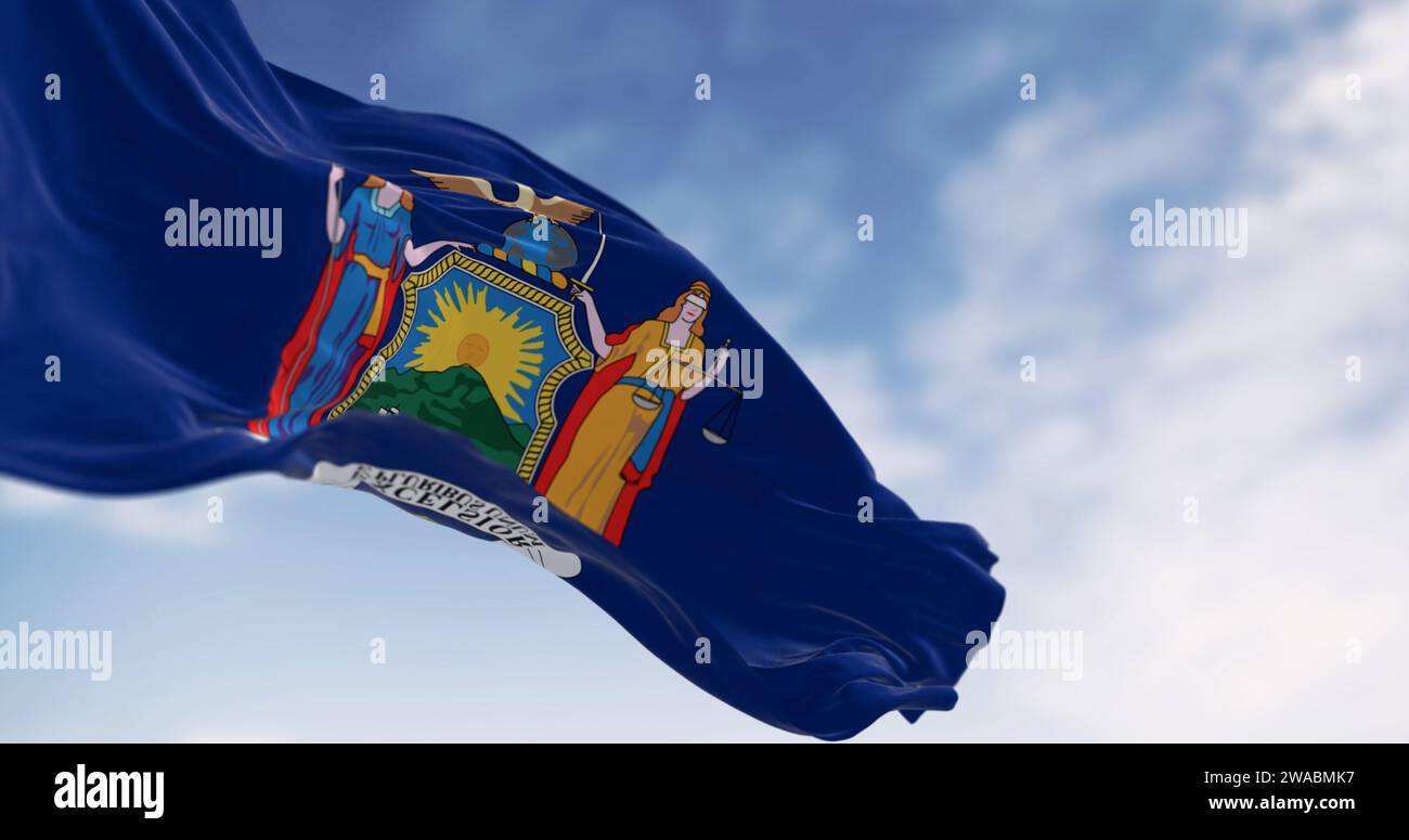 Close-up of New York State flag waving on a clear day. Blue background ...