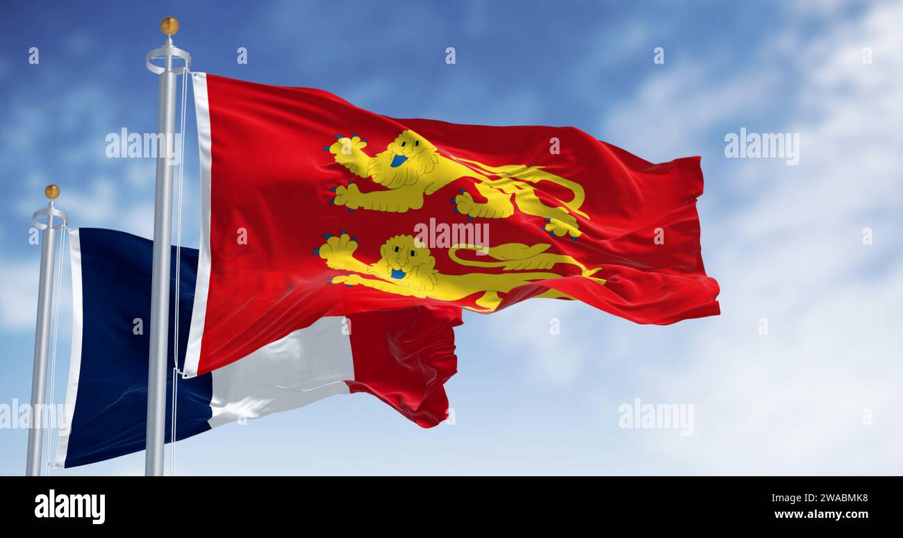 Flags of Normandy and France waving in the wind on a clear day ...