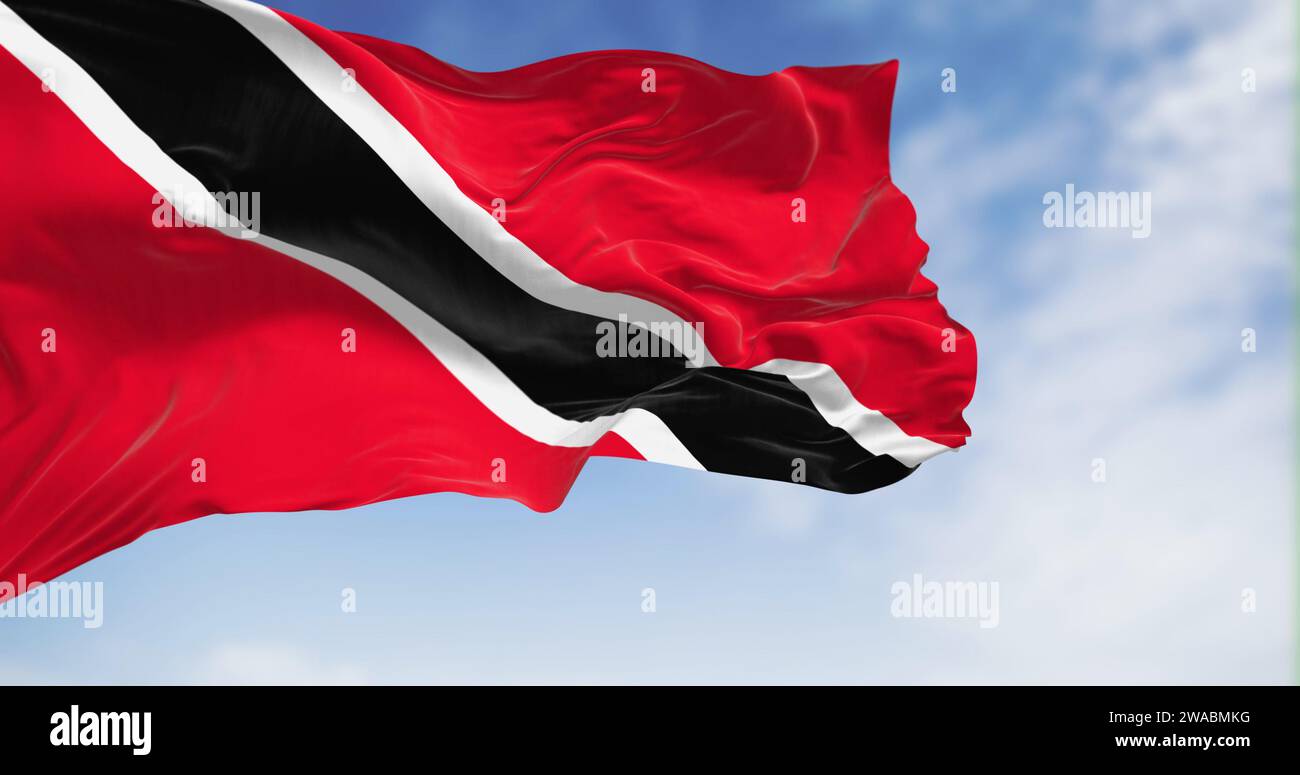 Trinidad and Tobago national flag waving on a clear day. The Republic of Trinidad and Tobago is ...