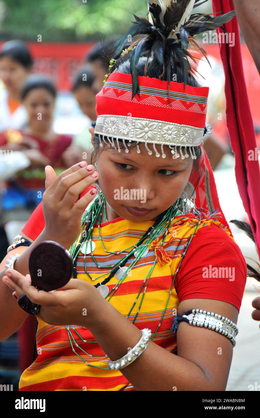 Women from the Garo community in traditional dress and ornaments, at a ...