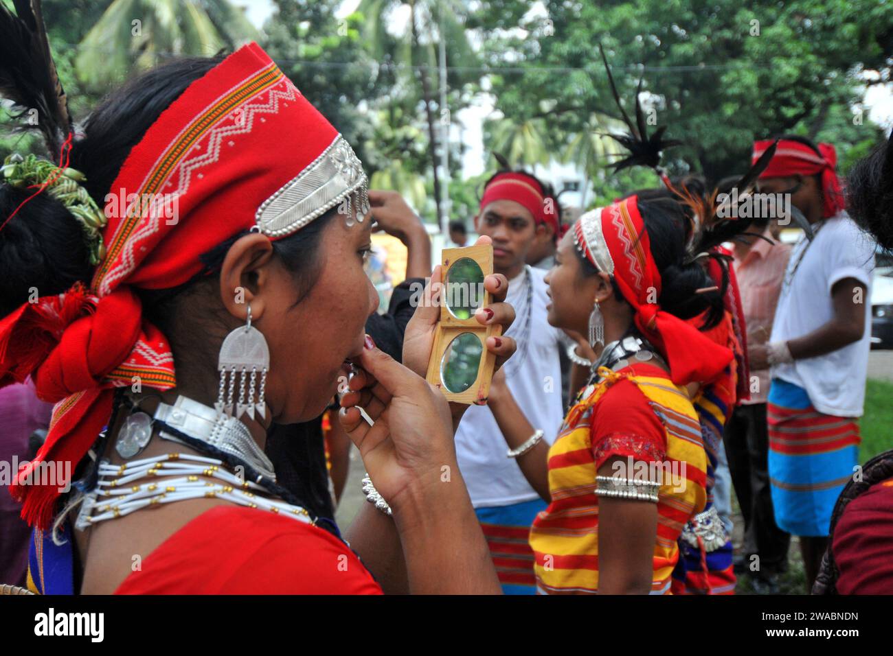 Women from the Garo community in traditional dress and ornaments, at a ...