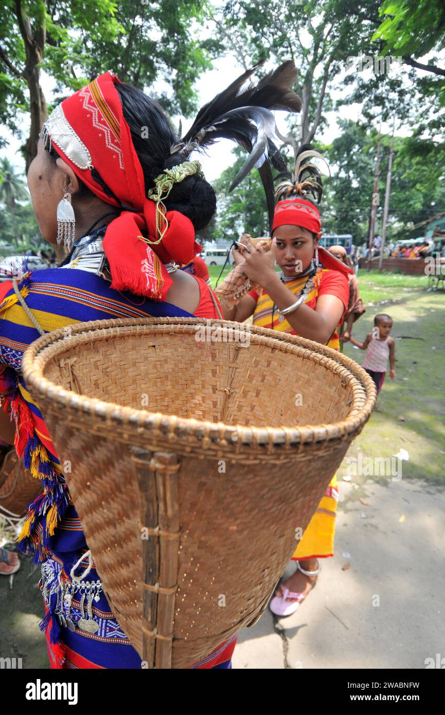 Women from the Garo community in traditional dress and ornaments, at a ...
