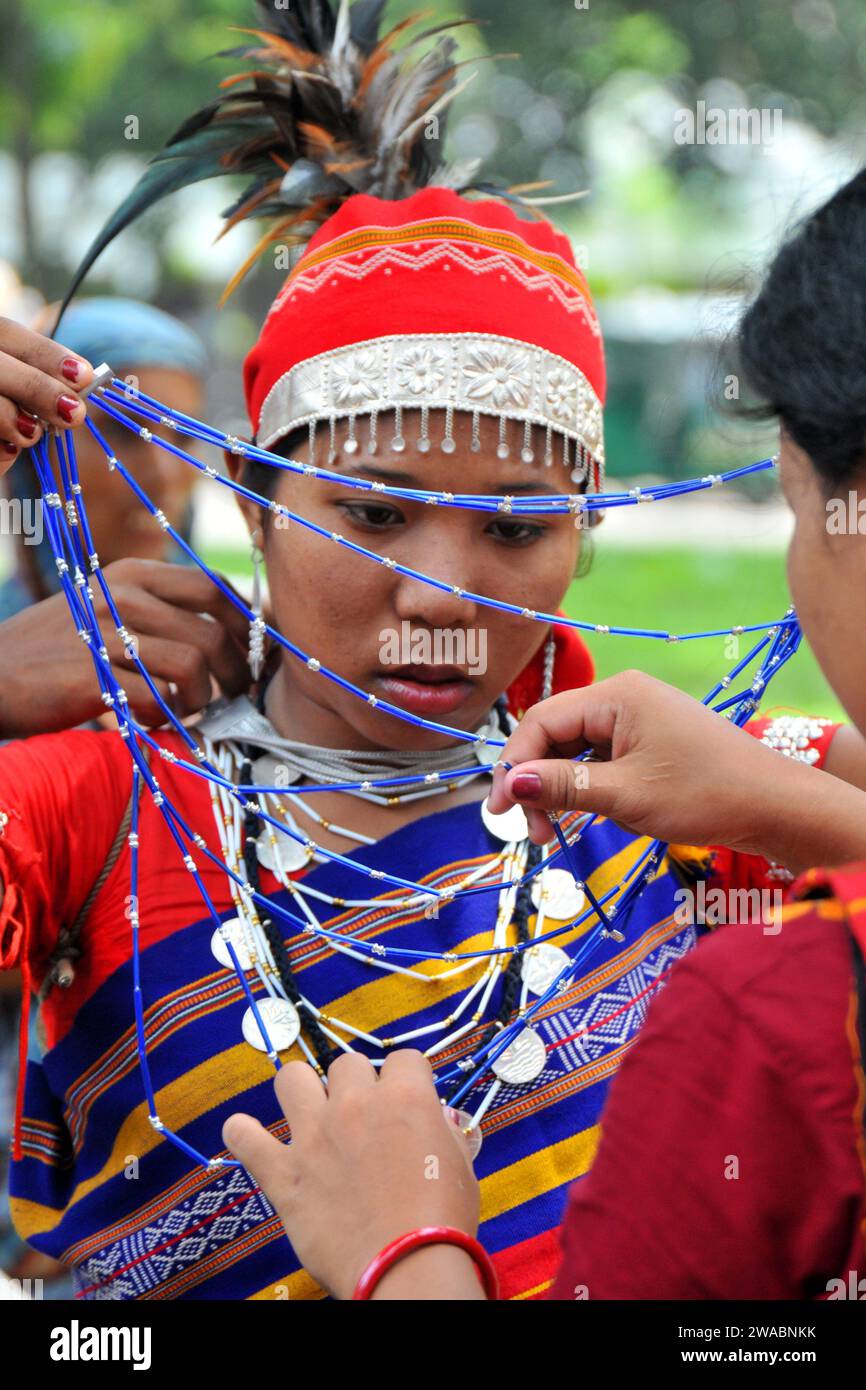 Women from the Garo community in traditional dress and ornaments, at a ...