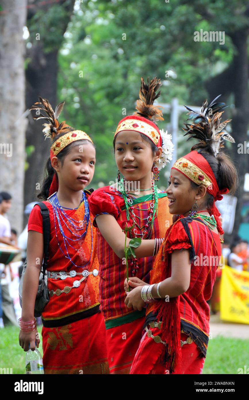 Women from the Garo community in traditional dress and ornaments, at a ...