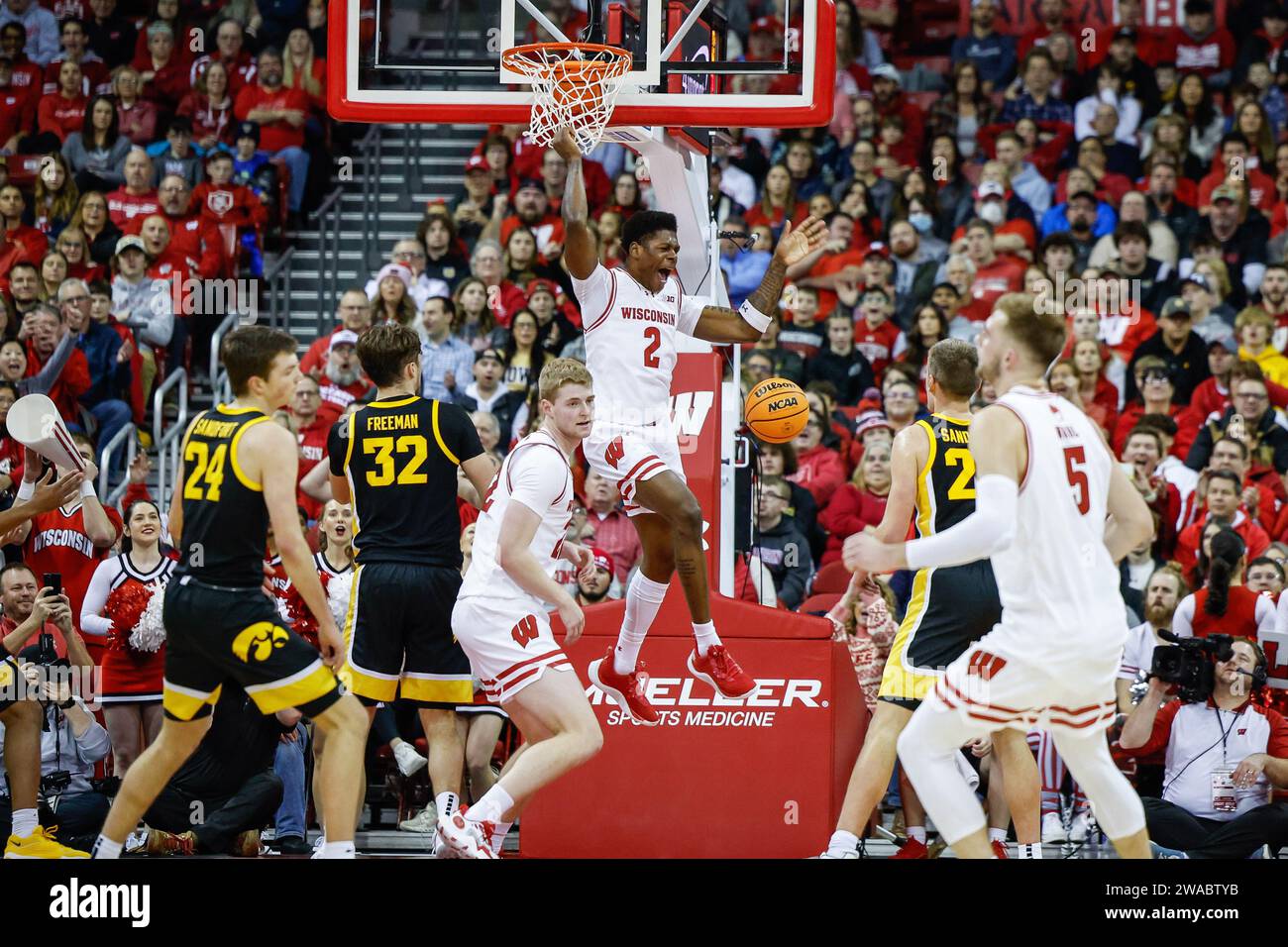 Madison, WI, USA. 2nd Jan, 2024. Wisconsin Badgers guard AJ Storr (2) goes in for a dunk during ...