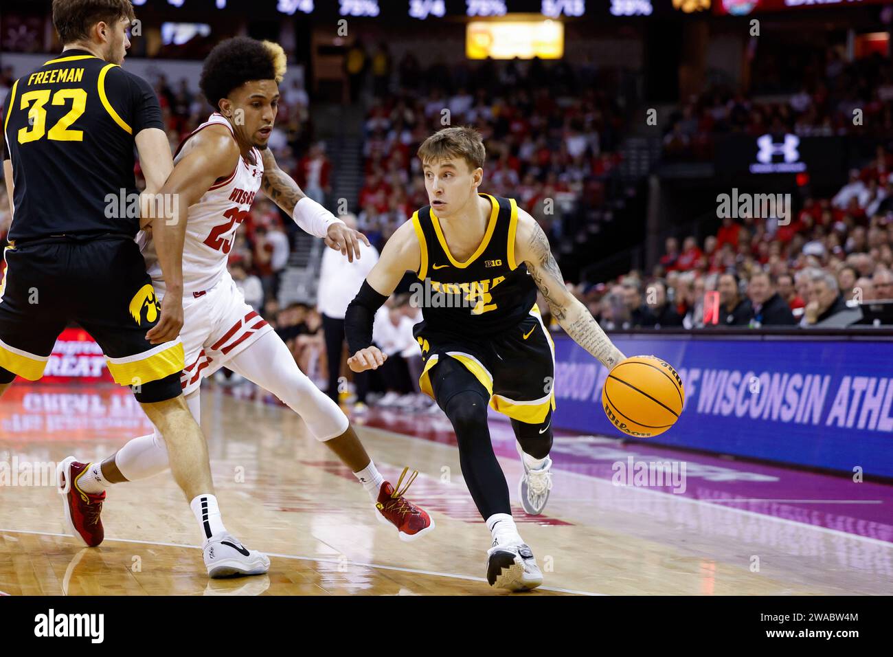 January 2, 2024: Iowa Hawkeyes guard Brock Harding (2) uses the screen ...