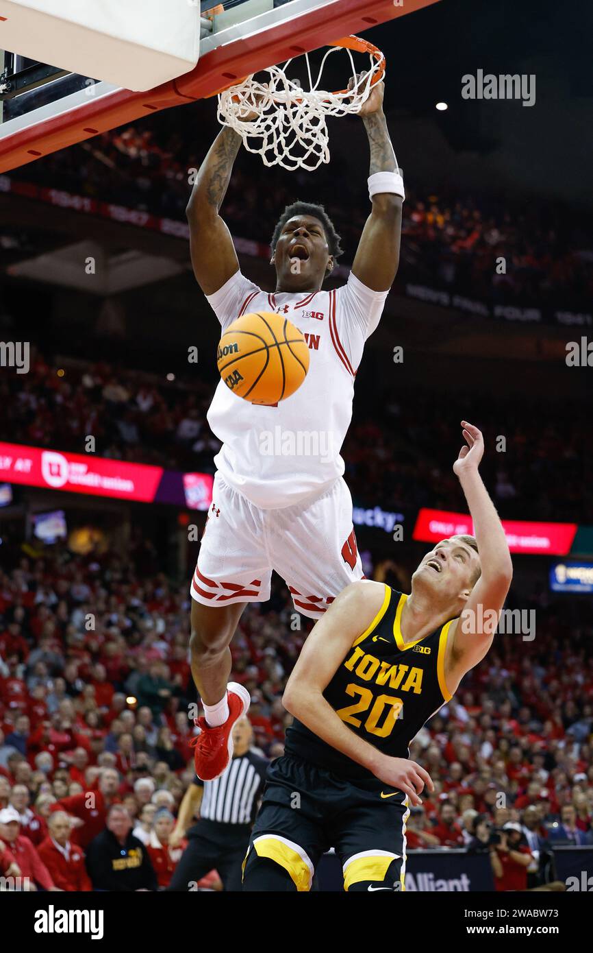 Madison, WI, USA. 2nd Jan, 2024. Wisconsin Badgers guard AJ Storr (2) throws down an alley oop ...