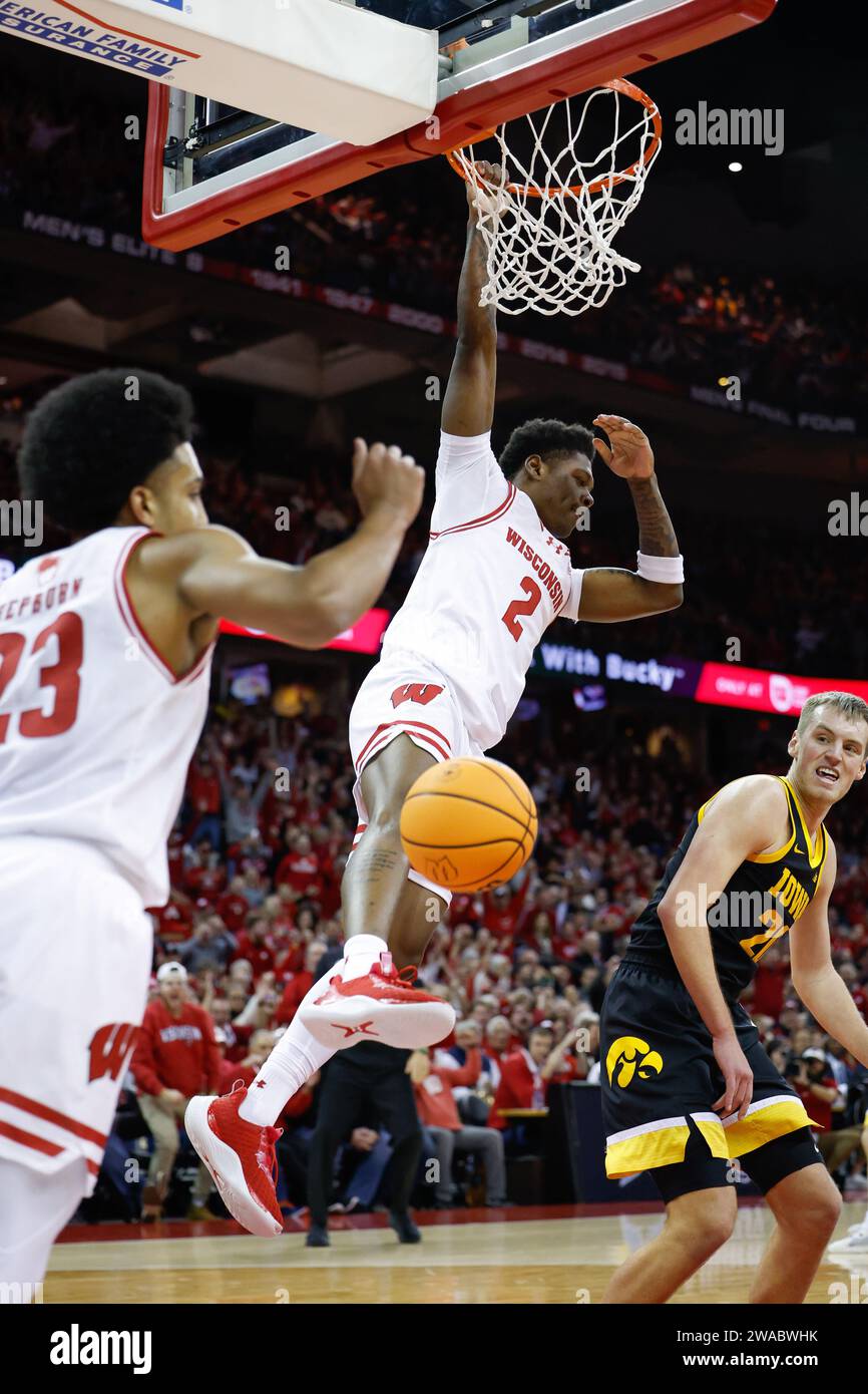 Madison, WI, USA. 2nd Jan, 2024. Wisconsin Badgers guard AJ Storr (2) throws down an alley oop ...