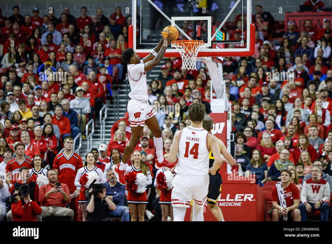Madison, WI, USA. 2nd Jan, 2024. Wisconsin Badgers guard AJ Storr (2) catches an alley oop and ...