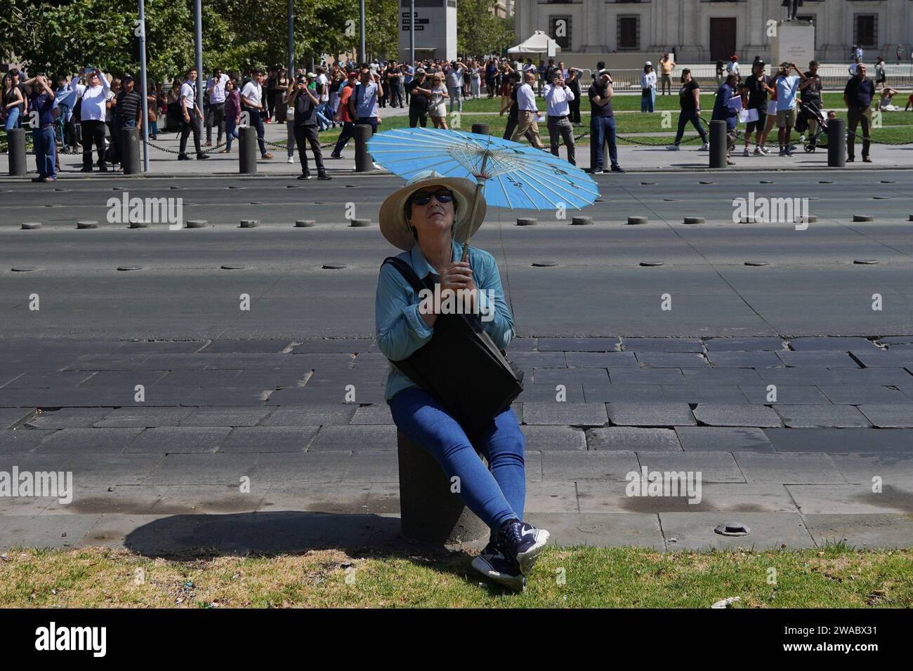 Santiago, Metropolitana, Chile. 3rd Jan, 2024. A woman watches the ...