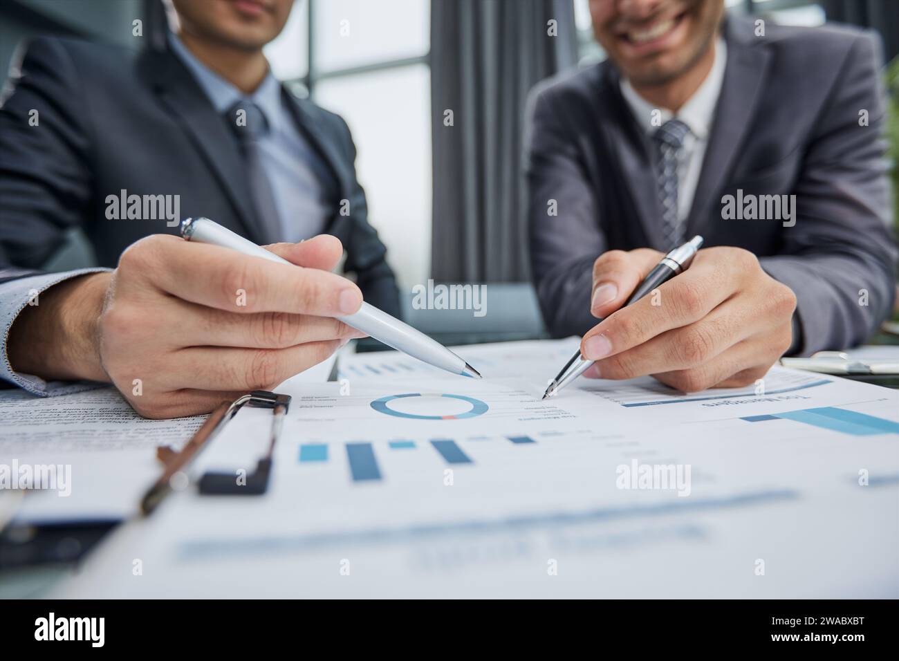hand of a businessman shows a close-up index on the growth charts ...