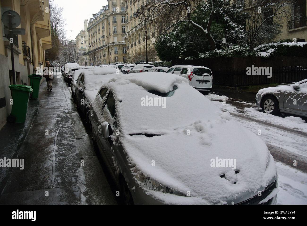 Unexpected snow in Paris. Street, cars covered with snow Stock Photo ...