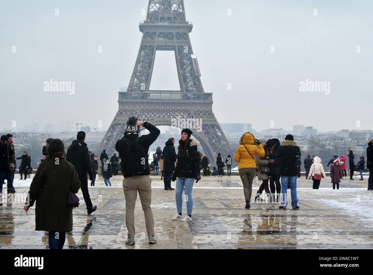Unexpected snow in Paris. At Trocadéro Square, many tourists take ...