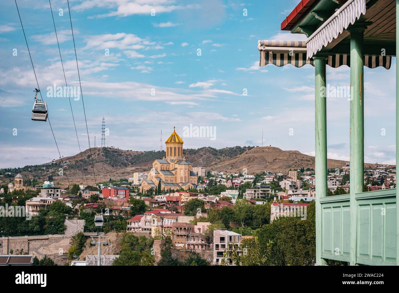 View of the Sameba Cathedral, the Tbilisi ropeway, and a traditional ...