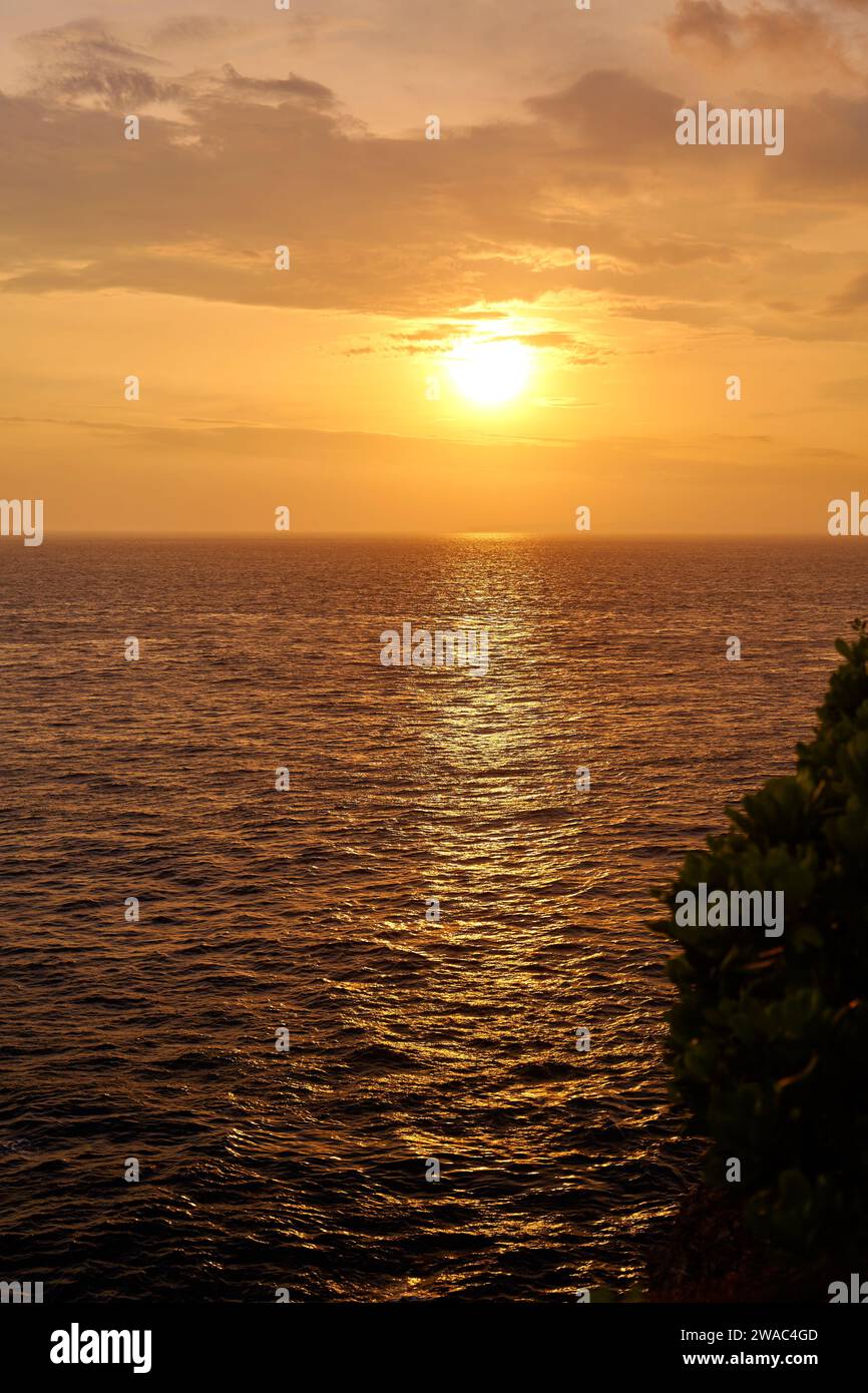 The view of the mountain and the ocean at sunset. A sunny path over the ...