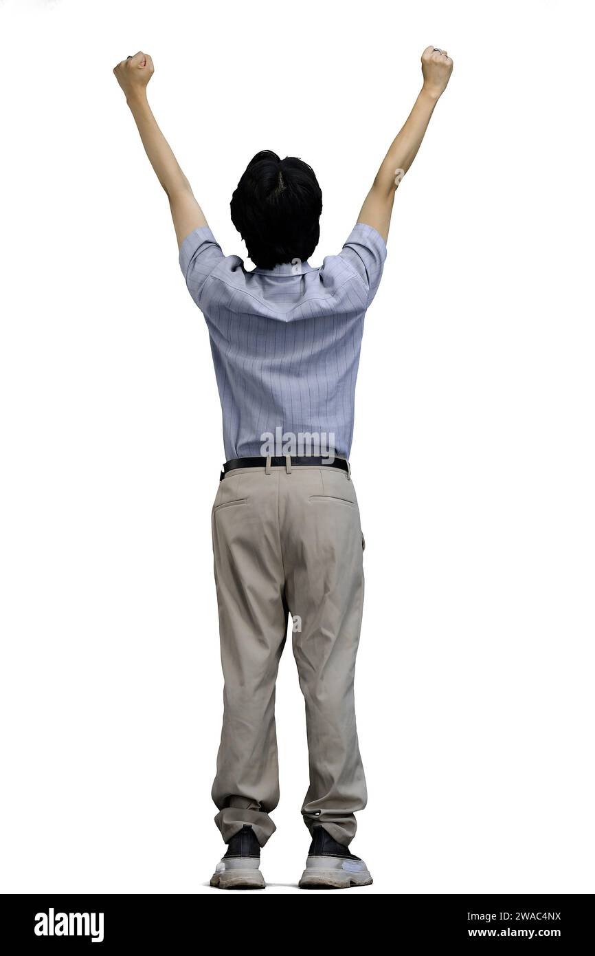 A guy in a blue shirt, on a white background, in full height, raises ...
