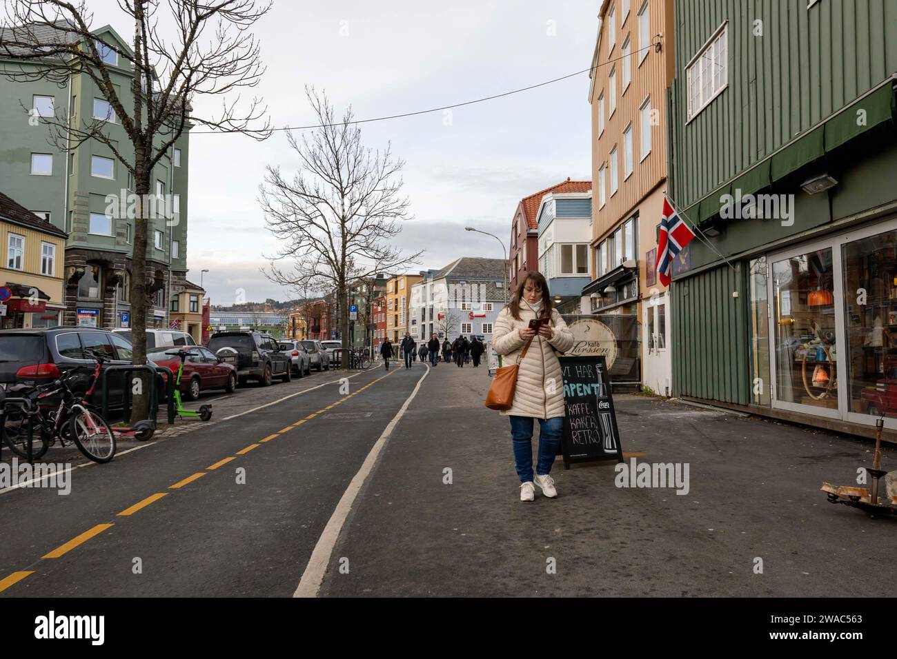 A person walks along Fjordgata street in downtown Trondhem. Trondheim ...