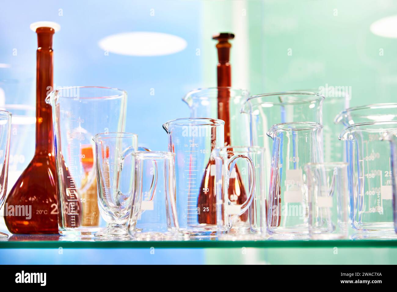 Laboratory glass dishes, bottles, jars and flasks in store Stock Photo ...