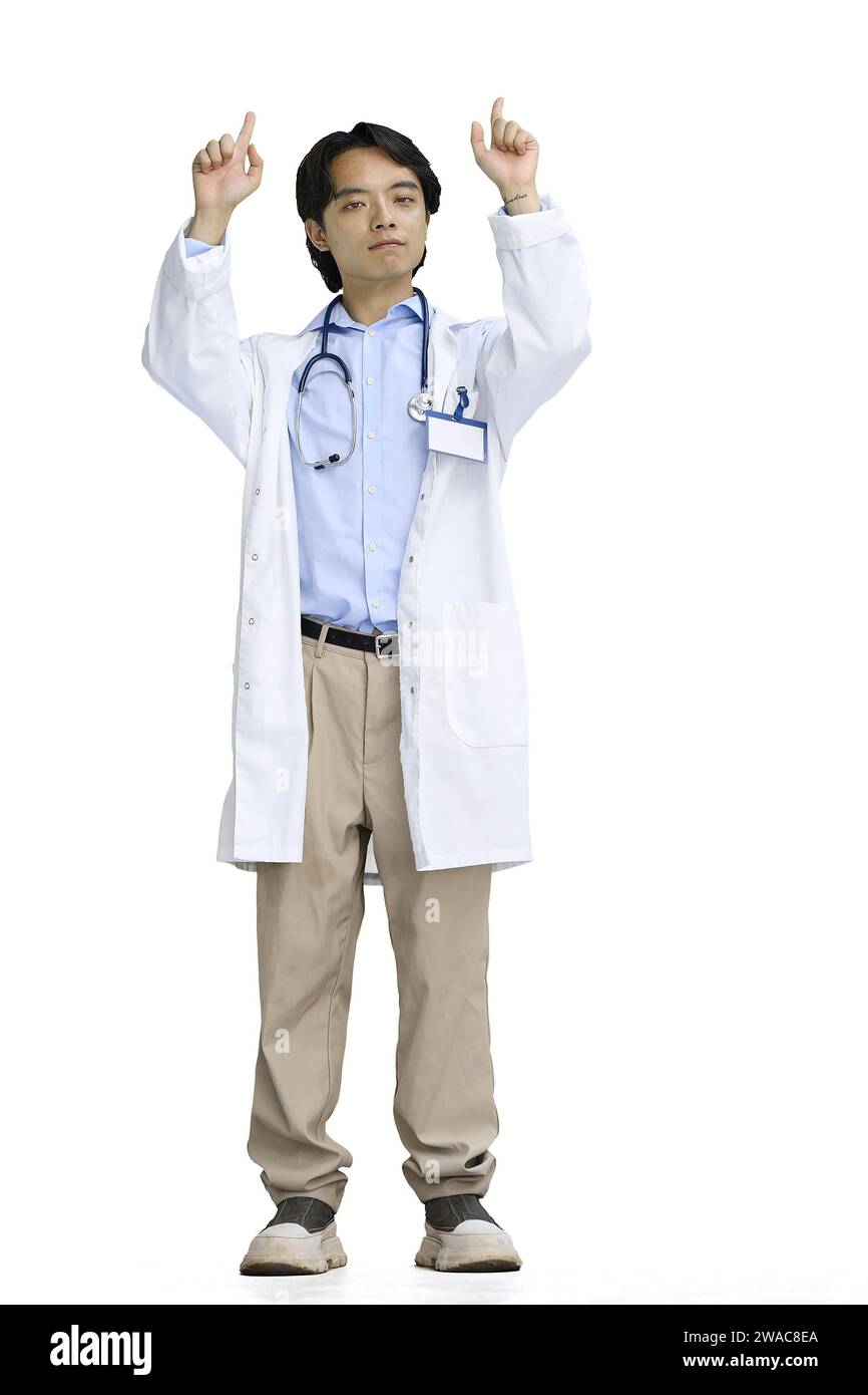 The guy is a doctor, on a white background, full-length, pointing up ...