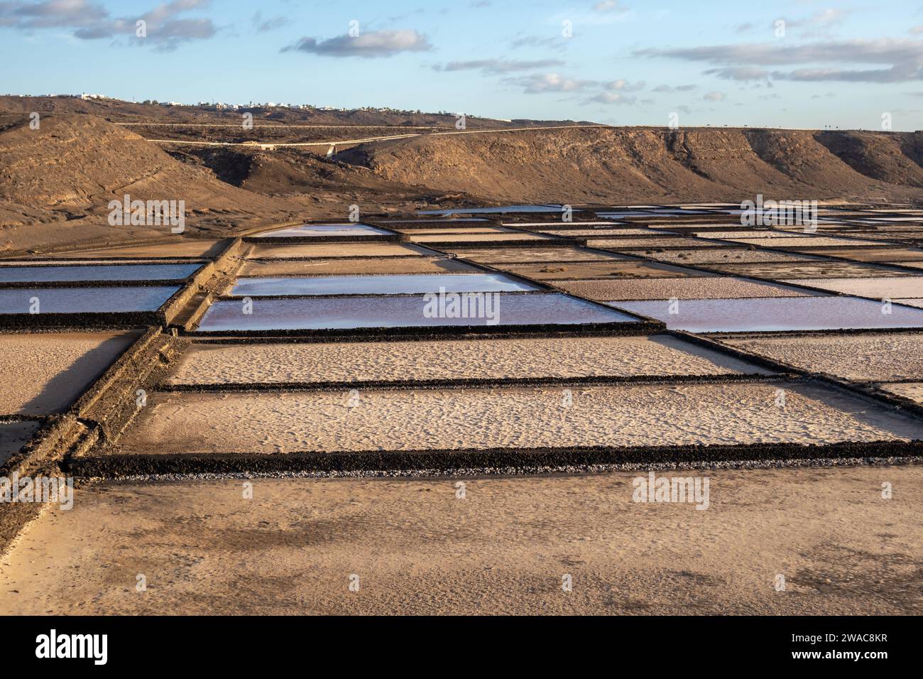 Photogenic industry: salt pans on the coast of the Atlantic ocean ...