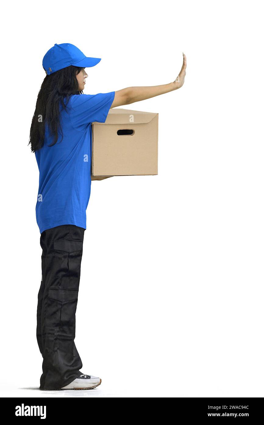 A delivery girl, on a white background, full-length, with a box, shows ...