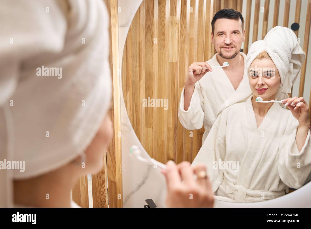 Young couple doing morning routine in bathroom Stock Photo - Alamy