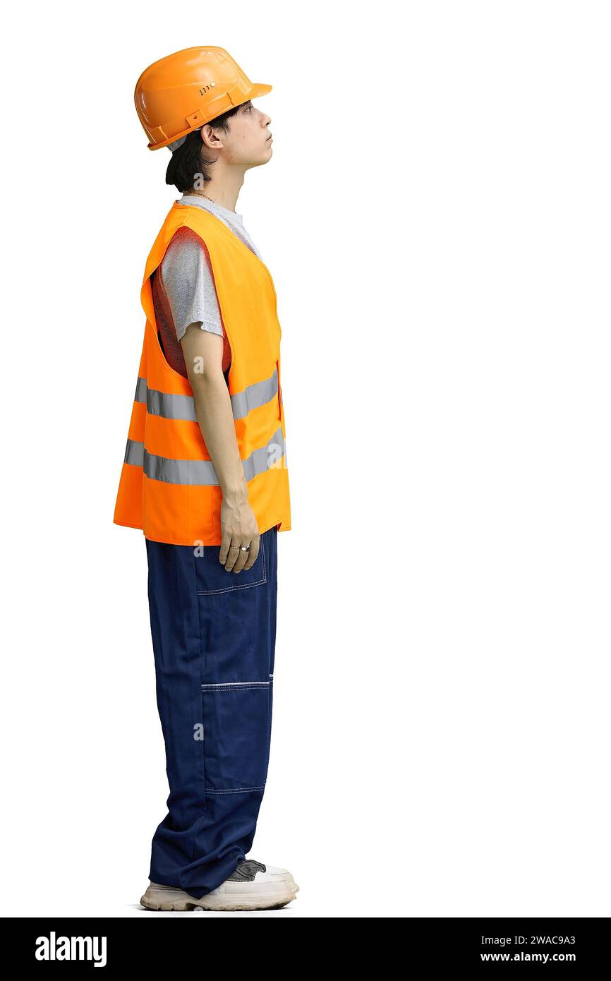 The guy is a builder, on a white background, in full height Stock Photo ...