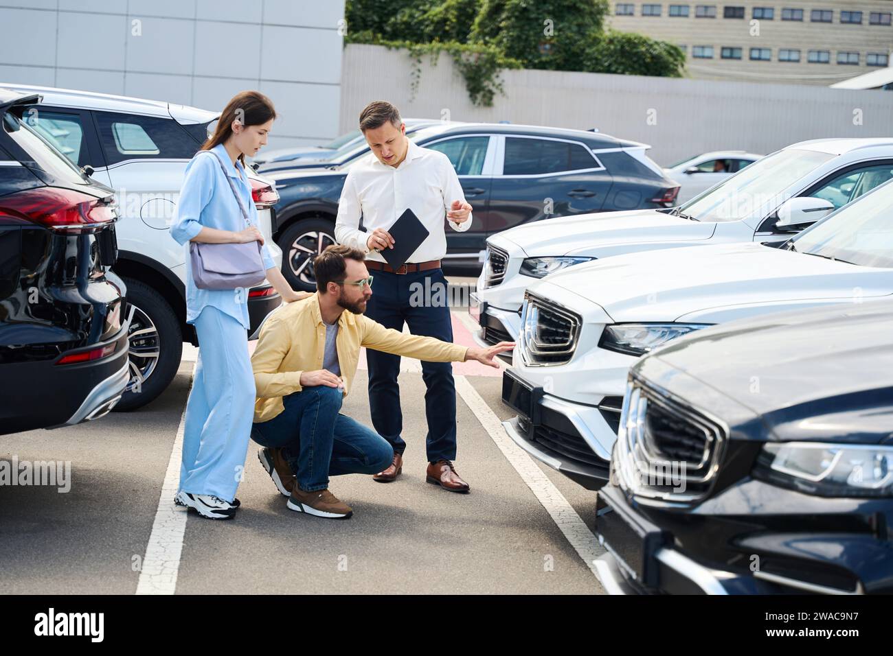 Car dealership manager advises hi-res stock photography and images - Alamy