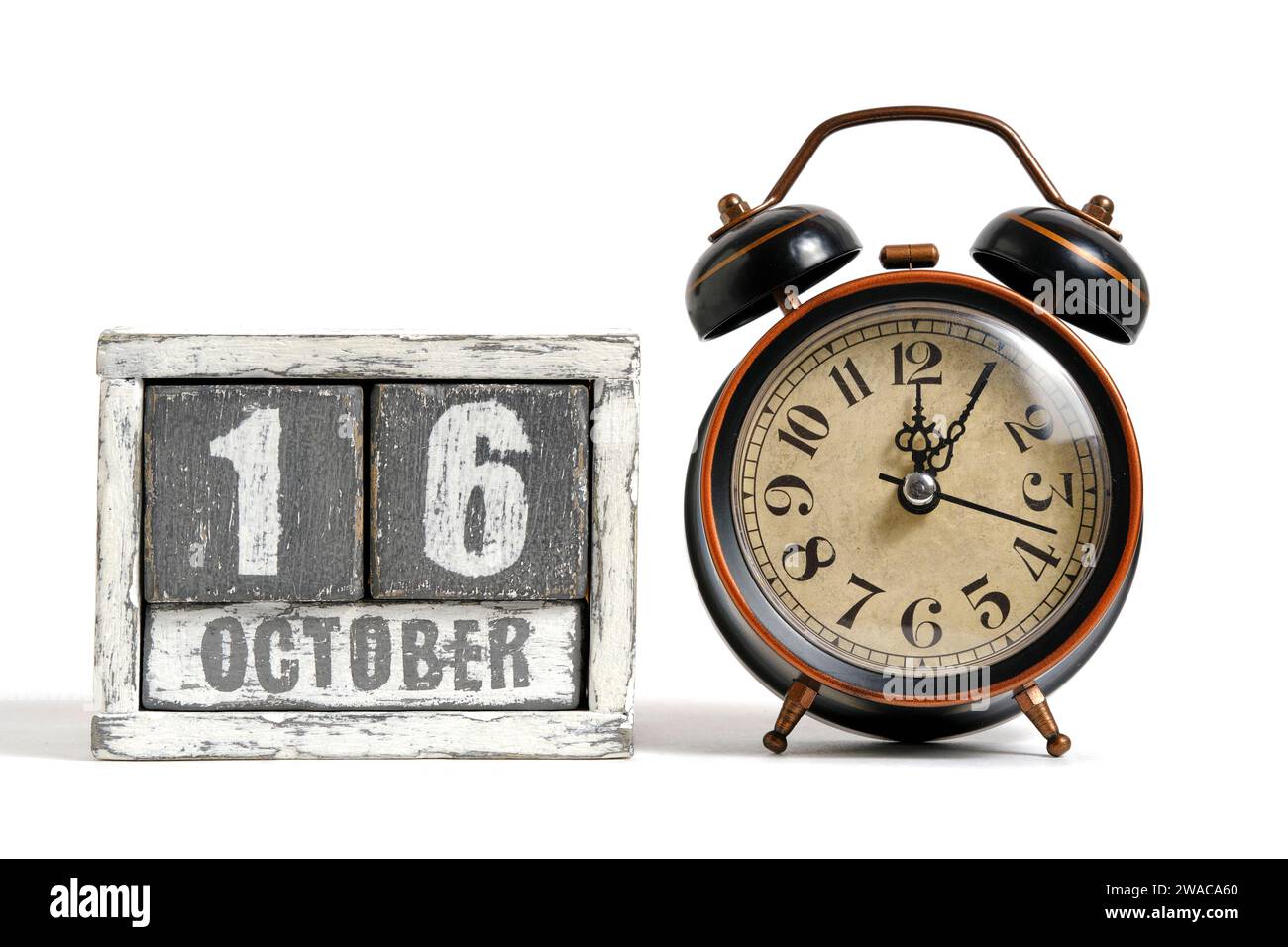 October 16 on wooden calendar with alarm clock white background Stock ...
