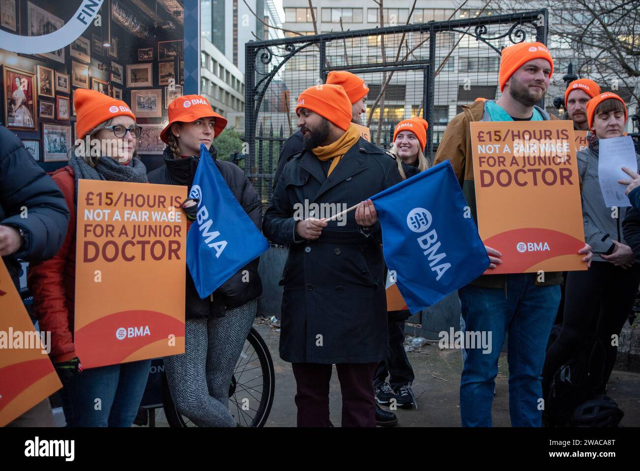 London, UK. 03rd Jan, 2024. Protesters hold placards and flags during a ...
