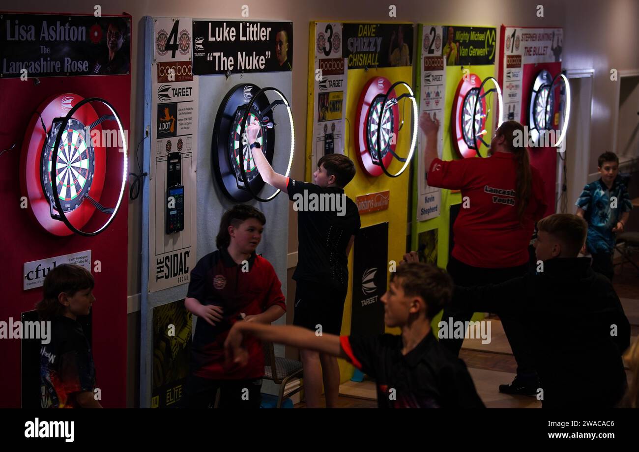 Members of Luke Littler's local club the St Helen's Darts Academy ...