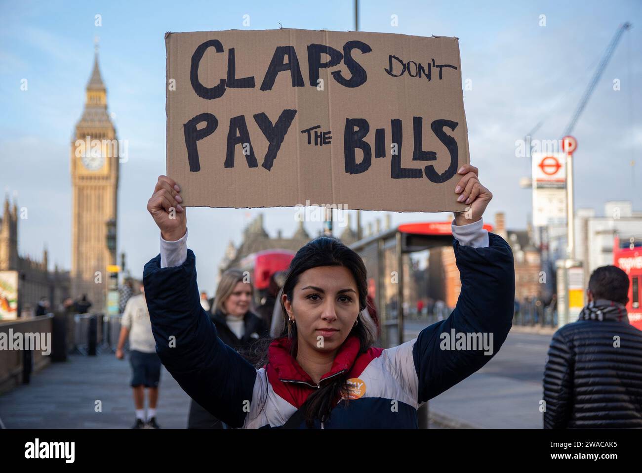 London, UK. 03rd Jan, 2024. A protester holds a placard reading "Claps ...