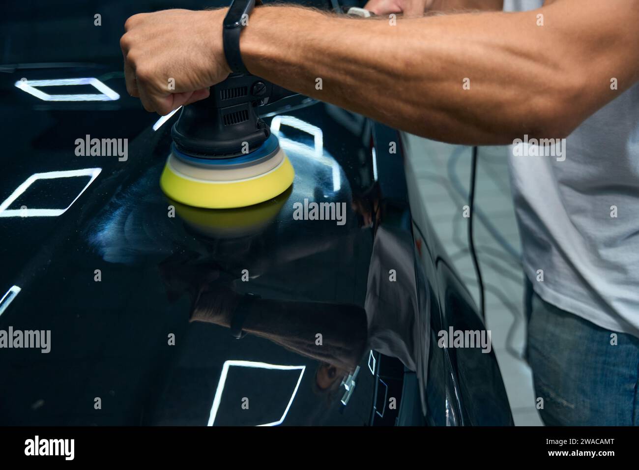 Detailing a modern car in a car repair shop Stock Photo - Alamy
