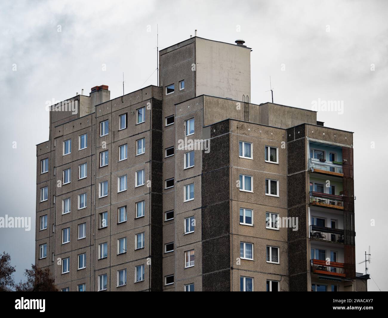 Dark apartment building in front of a cloudy sky. Socialist ...