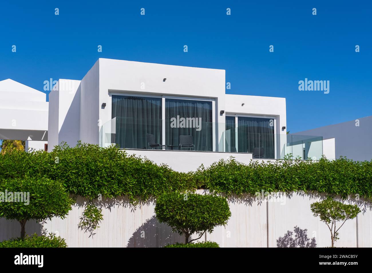 White villas in Middle East, on a background of blue sky. Holidays in ...