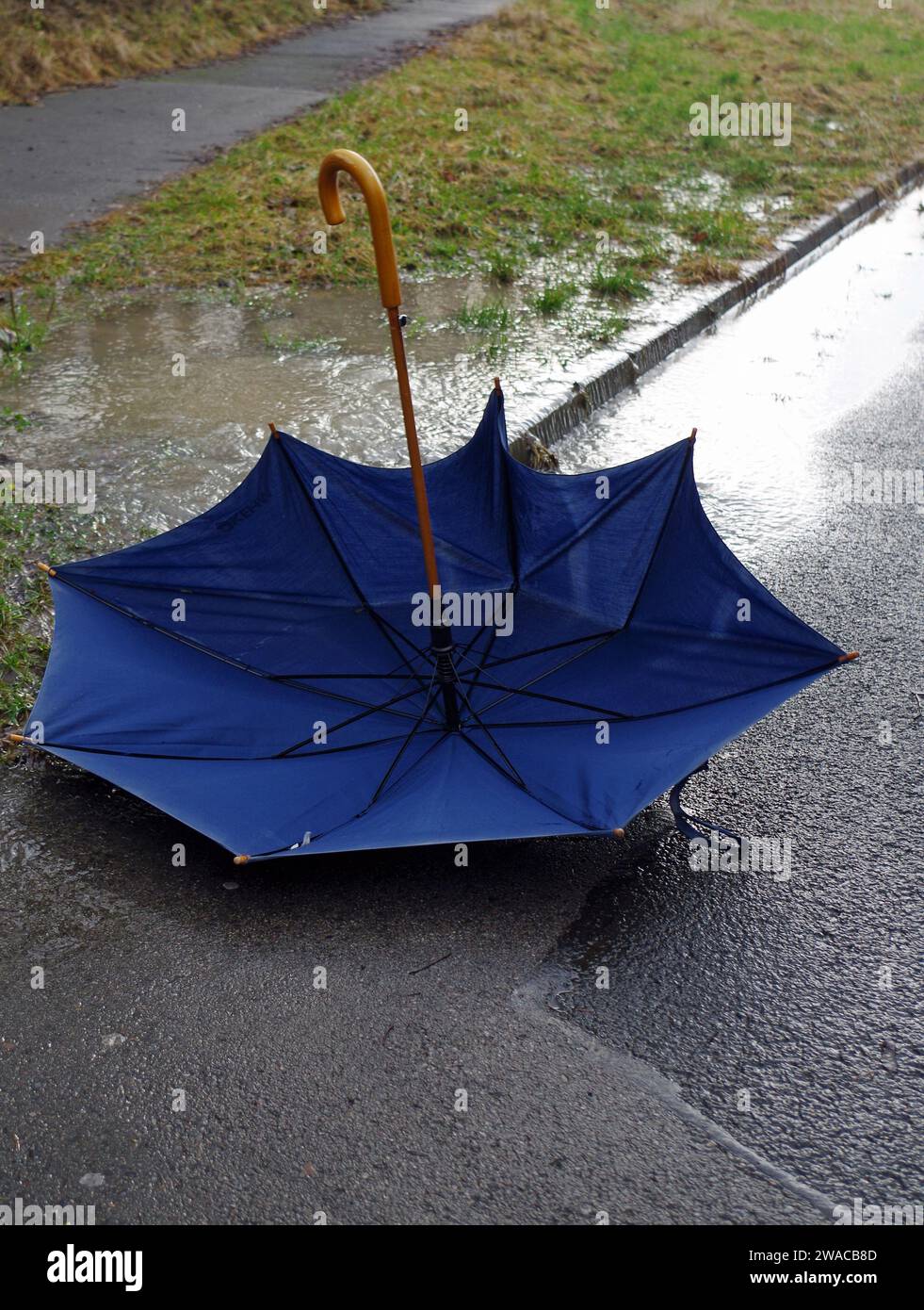 Useless umbrella hi-res stock photography and images - Alamy