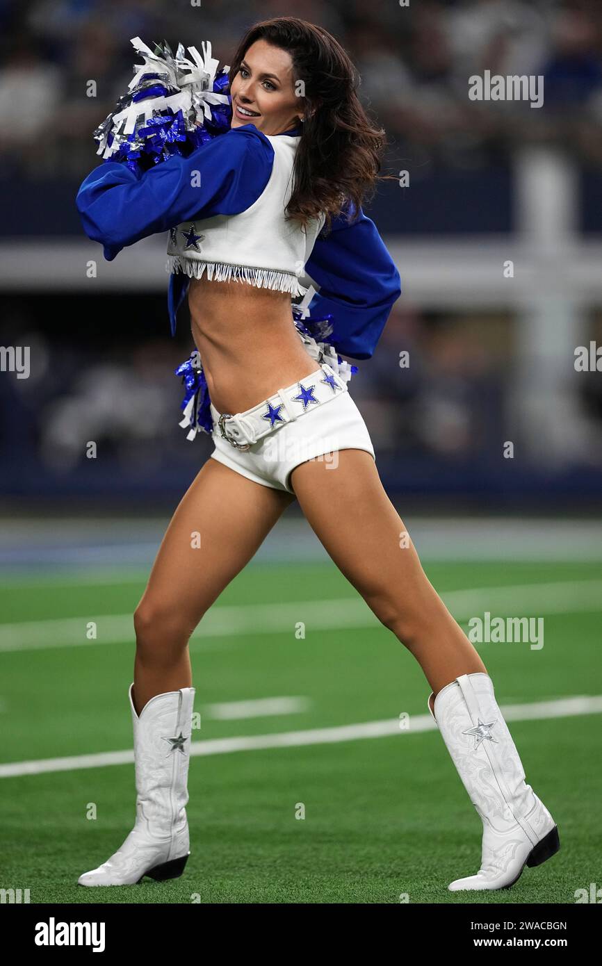 A Dallas Cowboys cheerleader performs during the first half of the game ...