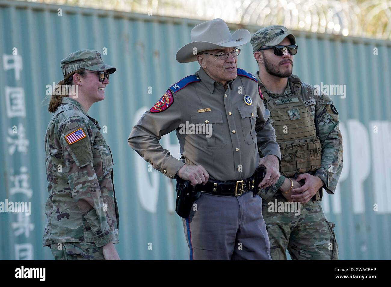 Texas Department of Public Safety chief Steve McCraw, center, stands ...