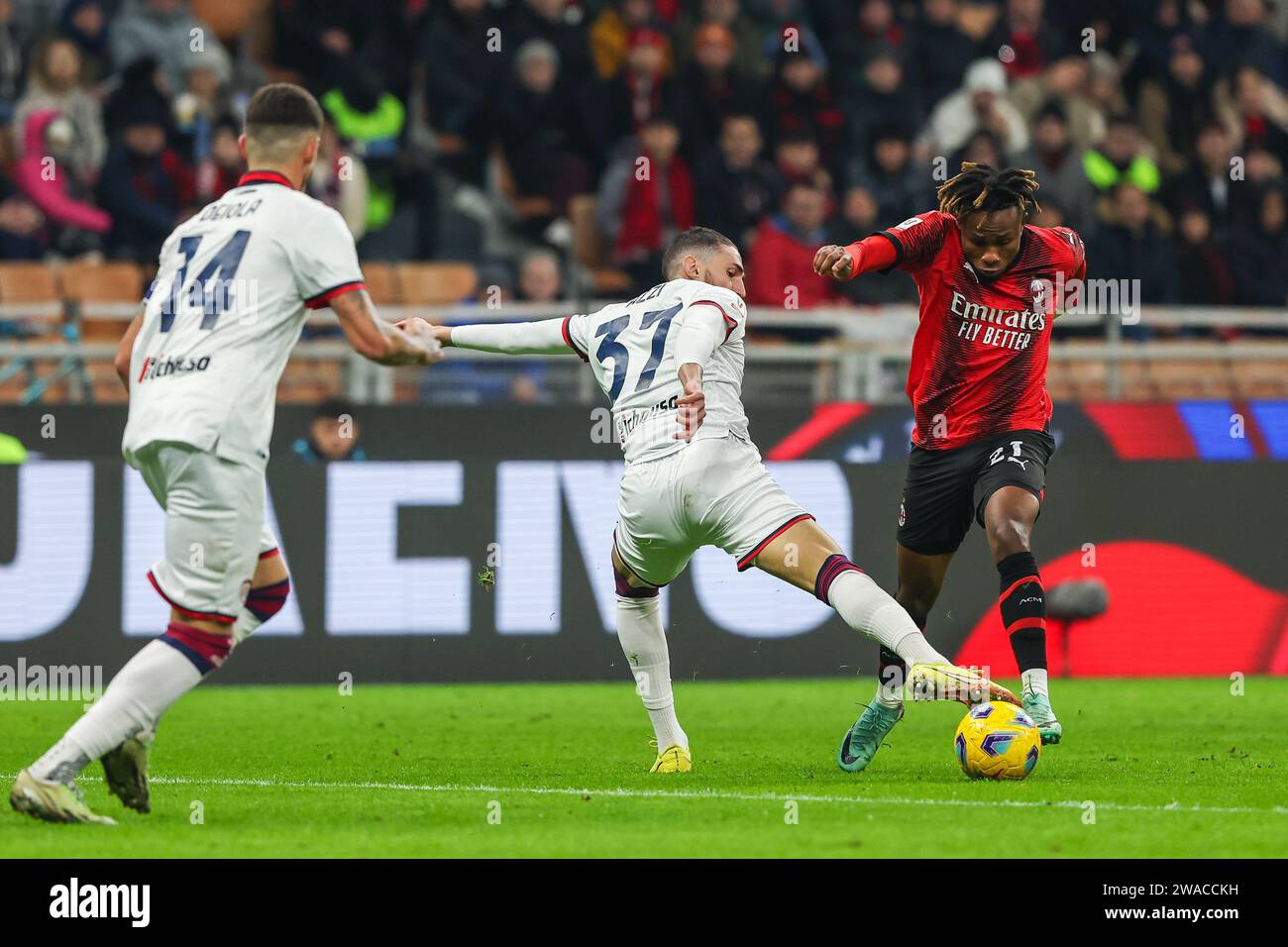 Samuel Chukwueze of AC Milan (R) and Paulo Azzi of Cagliari Calcio (L ...